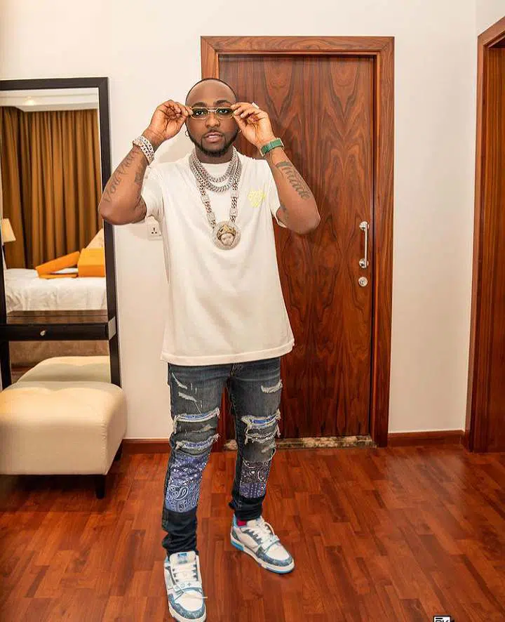 Moment Davido's bodyguard flung an overexcited fan who tried to get to ...