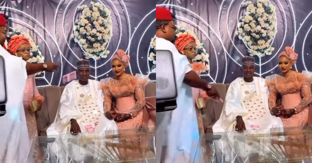 Wedding guest spraying money on couple in a 'rare' manner