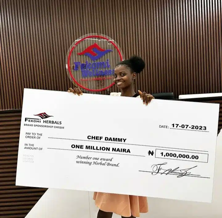 Chef Dammy all smiles as she receives N1m from businessman