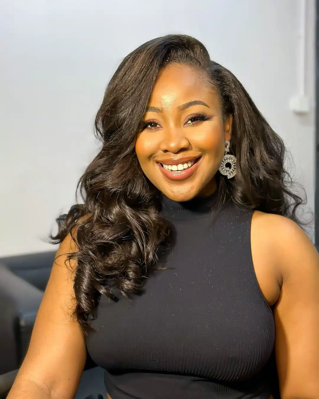 Erica stirs dating rumors as she enjoys Nigeria's match with man