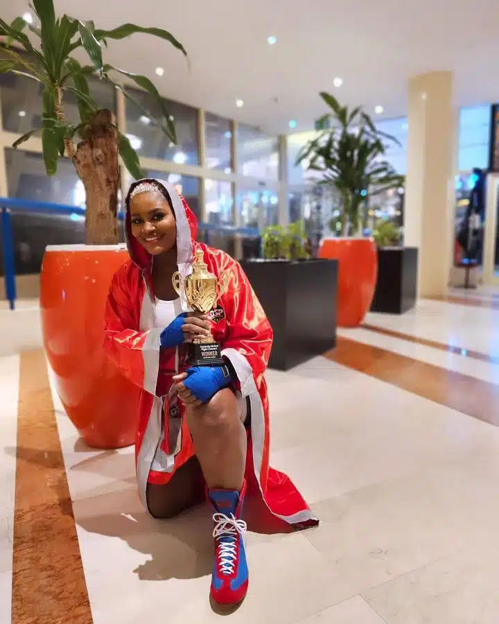 Chizzy Alichi celebrates victory over Laide Bakare in a boxing match