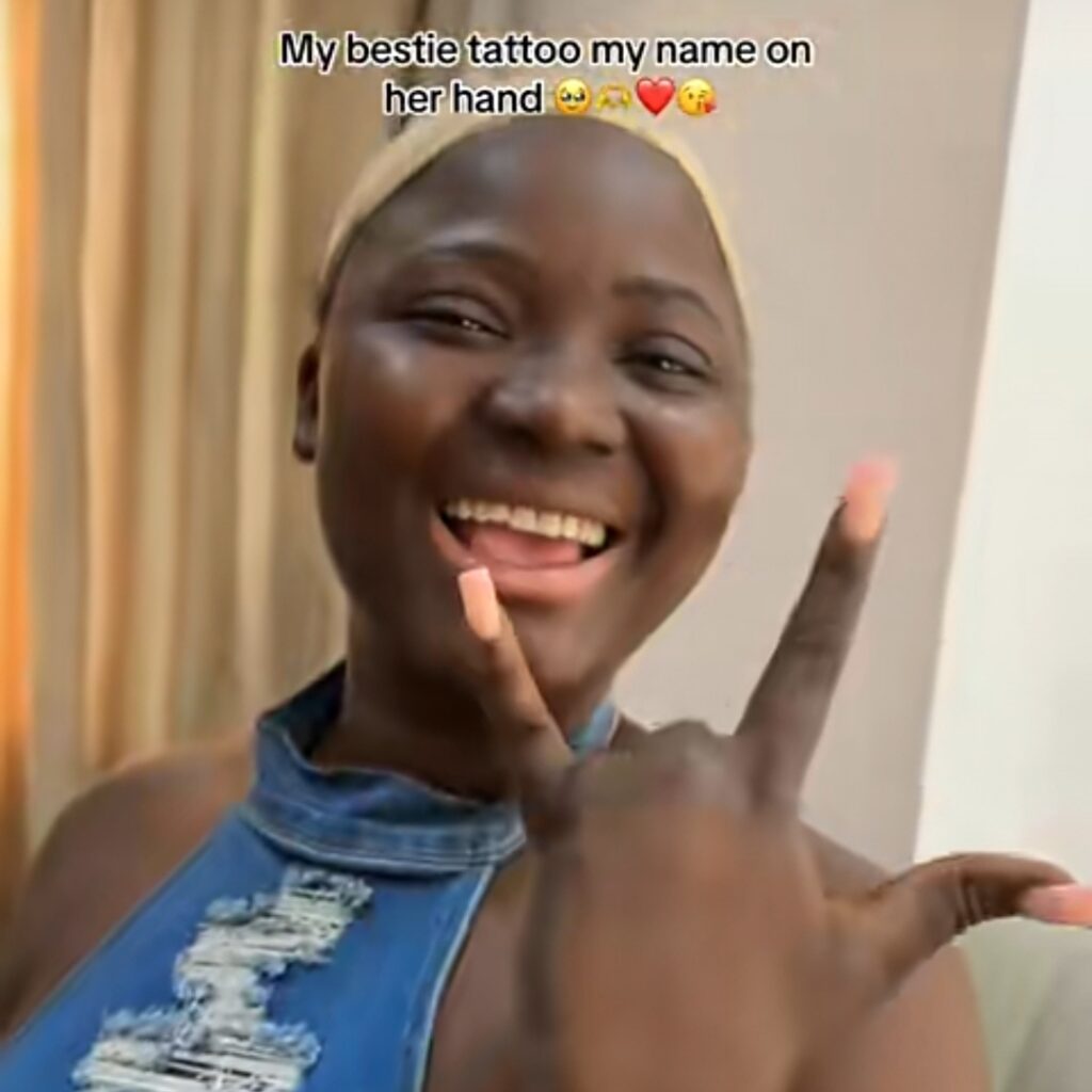 Nigerian lady gets tattoo of favorite TikToker, Mhiz Gold