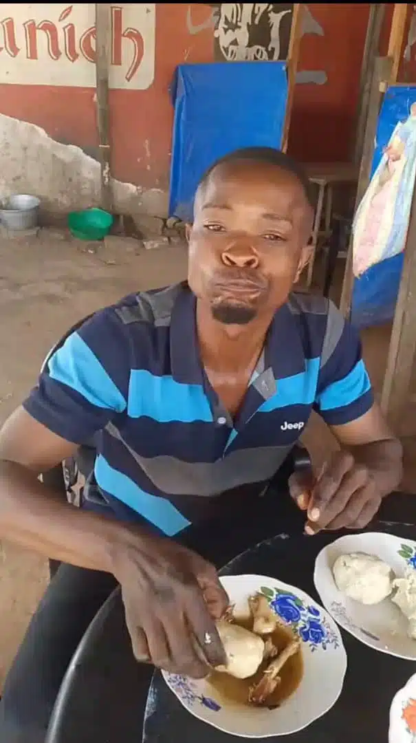 Man devouring large chunks of fufu with surprising ease